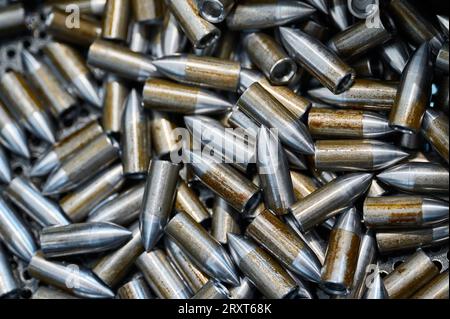 Scattered grey bullets armour ammunition as background Stock Photo - Alamy