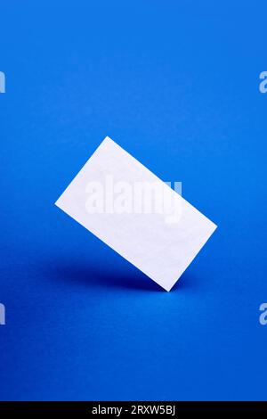 A sheet of paper mock up floating above the wooden table table Stock ...