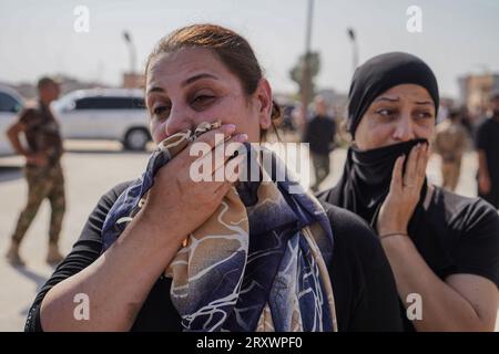 27 September 2023, Iraq, Hamdaniya: A man looks through the burnt down ...
