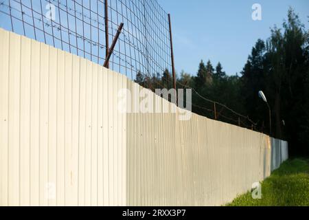 Steel fence around area. Stainless steel fence. Private territory. Rust ...