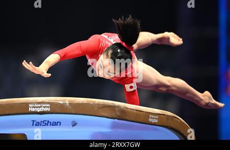 Mana Okamura of Japan competes on balance beam at the women's team ...