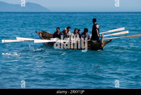 Chukchi Eskimos in umiak, a traditional boat made of walrus skin ...