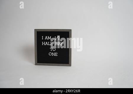 I'm halfway to one years old. half way to one black board on a white ...