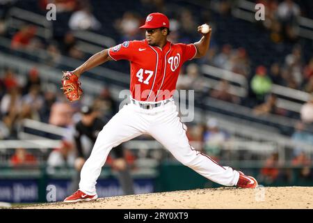 Washington Nationals relief pitcher Jose Ferrer, left, shakes hands ...