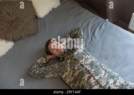 Closeup shot of a soldier sleeping in bed Stock Photo - Alamy