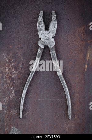 old rusty pliers lie on a white background close-up Stock Photo - Alamy