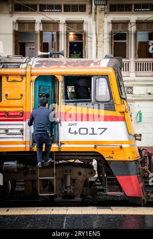 A locomotive pulls into the Train Street at the Old Quarter of Hanoi in ...