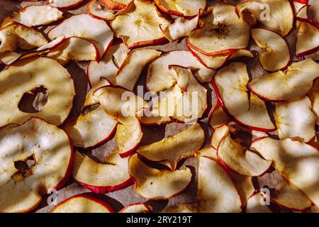 Sun-dried apple slices or apple chips and fresh apple Stock Photo - Alamy