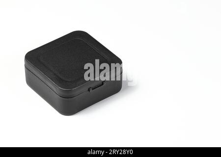 Empty small transparent and black plastic box isolated on white ...