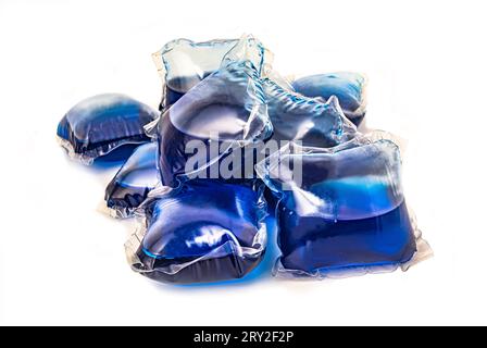 square capsules with blue washing gel on a white background. High ...