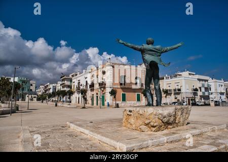 View of the Domenico Modugno bronze statue in Polignano a mare Stock ...