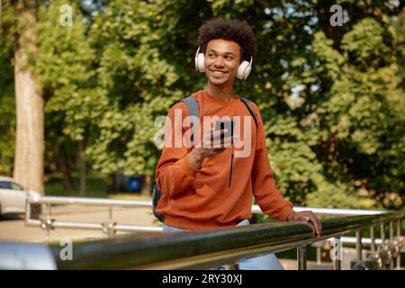 Teenage student wearing headphones using laptop with copy space Stock ...