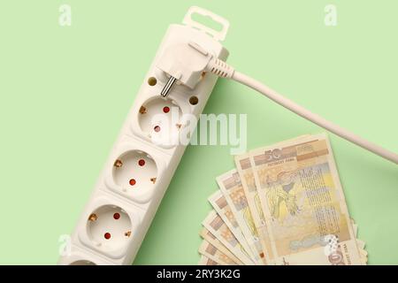 Bulgarian lev banknotes with plug and power socket on green background ...