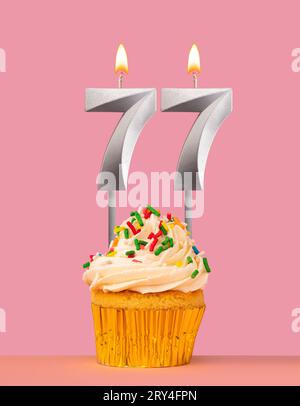 Birthday card number 77 - Cupcake with balloons Stock Photo - Alamy