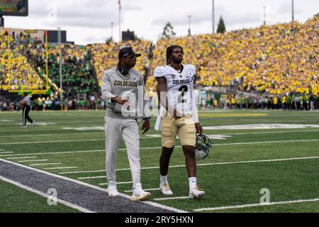 Colorado head coach Deion Sanders talks with his son, quarterback ...
