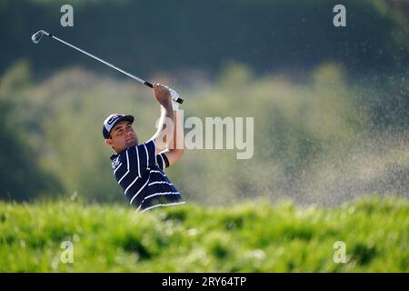 USA's Scottie Scheffler chips out of a bunker on the 8th during day ...