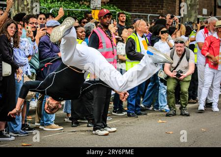 Acrobates perform dance in the Notting Hill Carnival parade, London ...