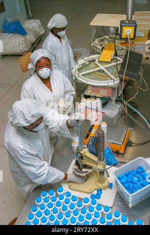 Ghana, Accra. Production line and female workers of Phyto Riker ...