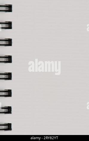 Spiral notebook closeup paper texture on wood table Stock Photo - Alamy
