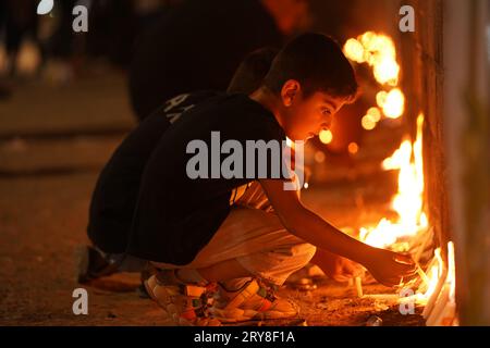 Hamdaniya, Iraq. 29th Sep, 2023. People light candles outside St Mary ...