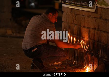Hamdaniya, Iraq. 29th Sep, 2023. People light candles outside St Mary ...