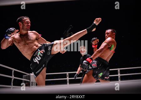 Seksan (L) of Thailand and Amir Naseri of Iranian-Malaysian seen in ...