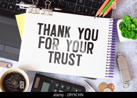 Thank you for your trust. text on white paper over torn paper background Stock Photo - Alamy