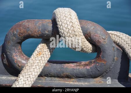 Mooring line turned on a barge fairlead with an NGV in the background ...
