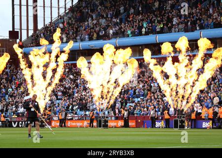 Pyrotechnics are set off as the teams make their way onto the pitch ...