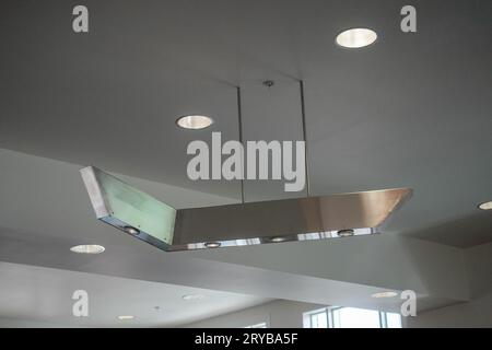 metal hockey stick shape light fixture Stock Photo - Alamy