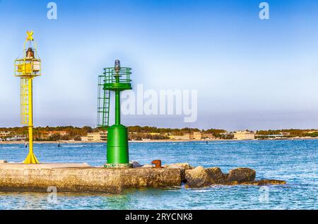 Yellow and green lighthouses Stock Photo - Alamy