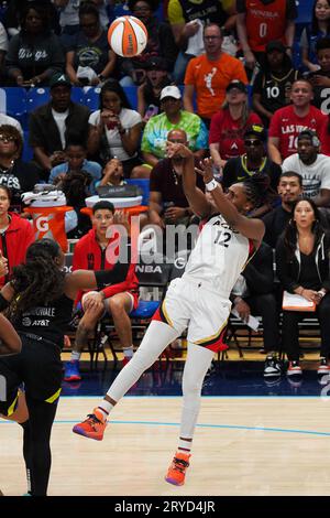 Las Vegas Aces' Chelsea Gray; her wife, Tipesa Gray; and Aces' Jackie ...