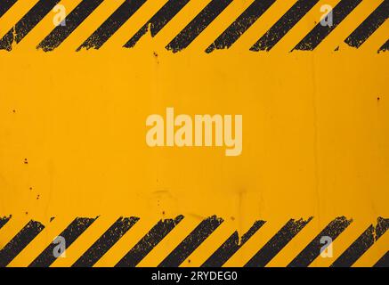 Yellow background with black grunge hazard sign Stock Photo - Alamy