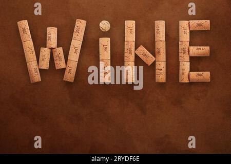 Word wine shaped by corks on brown paper parchment Stock Photo - Alamy