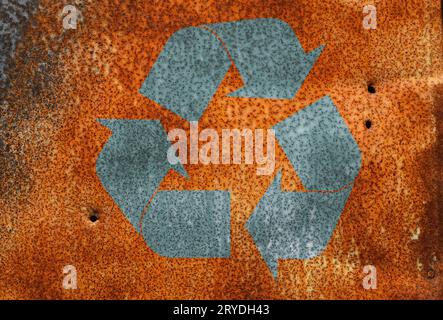 Rust stained corroded metal surfacewith recycling logo sign Stock Photo ...