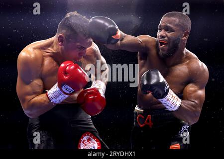 Cheavon Clarke (right) and Vasil Ducar in action during the ...
