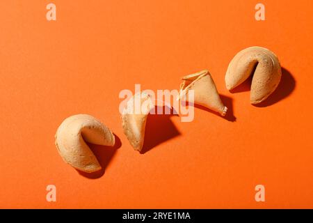 Fortune cookies on orange background Stock Photo - Alamy
