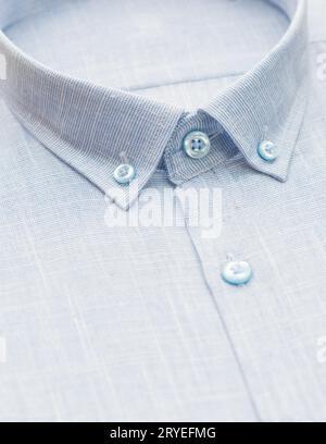 Close-up of a gray shirt's collar and button detailing, highlighting ...
