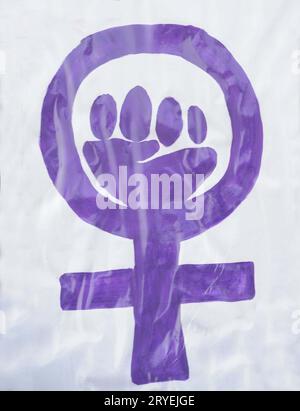 Raised fist within Venus symbol Stock Photo - Alamy