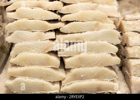 Pile of Dried salted cod at fish shop. Typical spanish and portuguese ...
