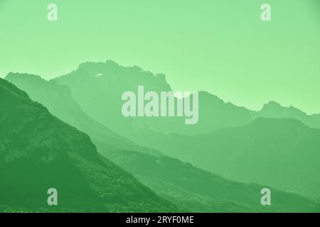 Green toned aerial perspective mountain range landscape with clear sky ...