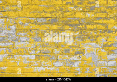 Gray brick wall with flakes of yellow paint Stock Photo - Alamy
