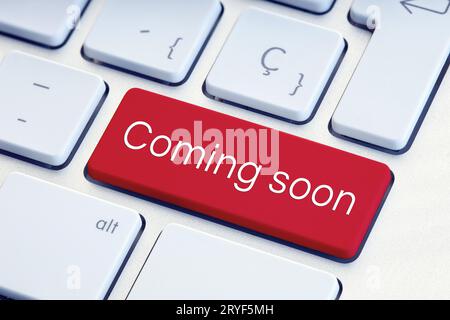 Coming soon phrase on computer Keyboard Key Stock Photo - Alamy