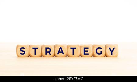 Strategy word on wooden table Stock Photo - Alamy