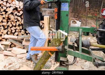 splitting of wood in the forest, timber industry and forestry wood ...