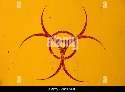 Red biohazard sign over yellow background Stock Photo - Alamy