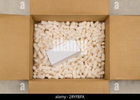Cardboard box with styrofoam filler for safe packaging. Stationery ...