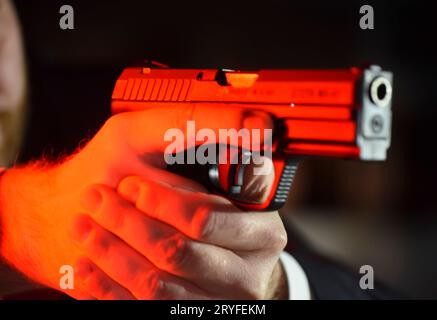 An attacker with a gun Stock Photo - Alamy