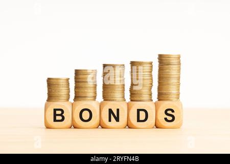 Bonds word on wood block with growing stacked coins. Bonds increasing ...