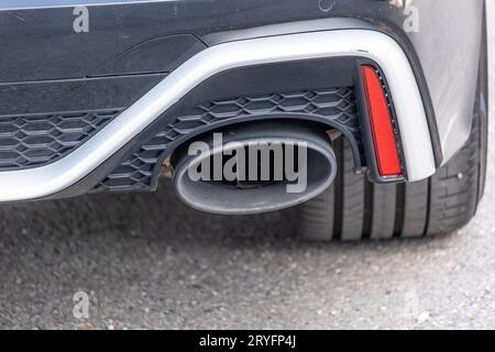 motor Vehicle Exhaust pipe with tires Stock Photo - Alamy
